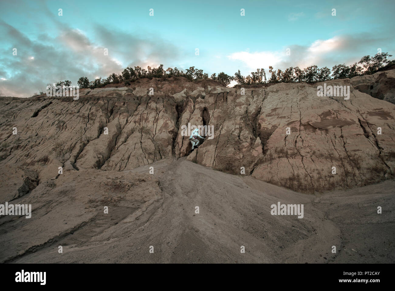 Spaceman exploring nameless planet Stock Photo - Alamy