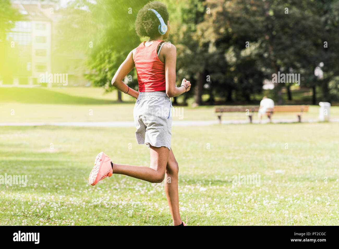 Woman running with headphones hi-res stock photography and images - Alamy