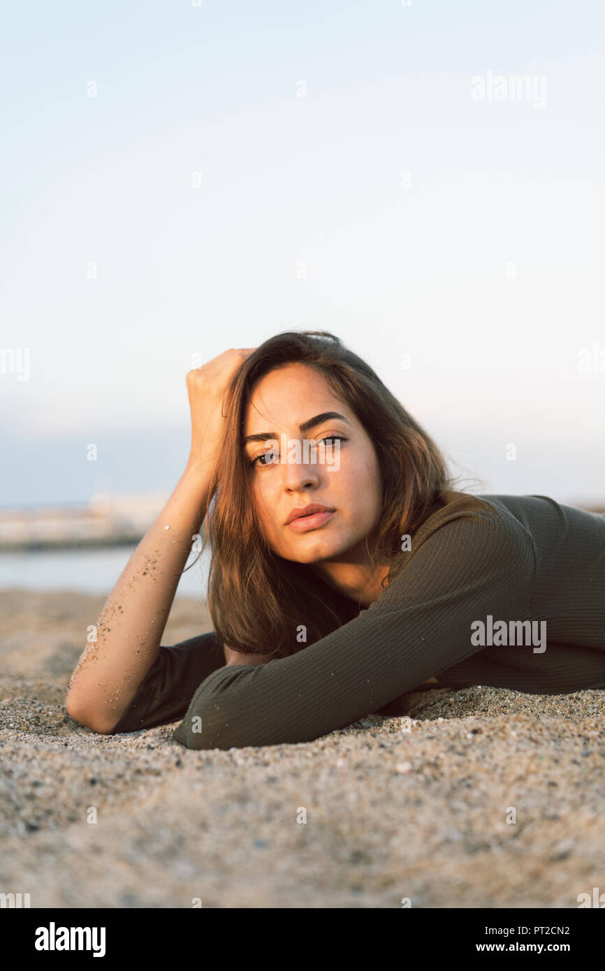 Beautiful woman relaxing beach sunset hi-res stock photography and ...