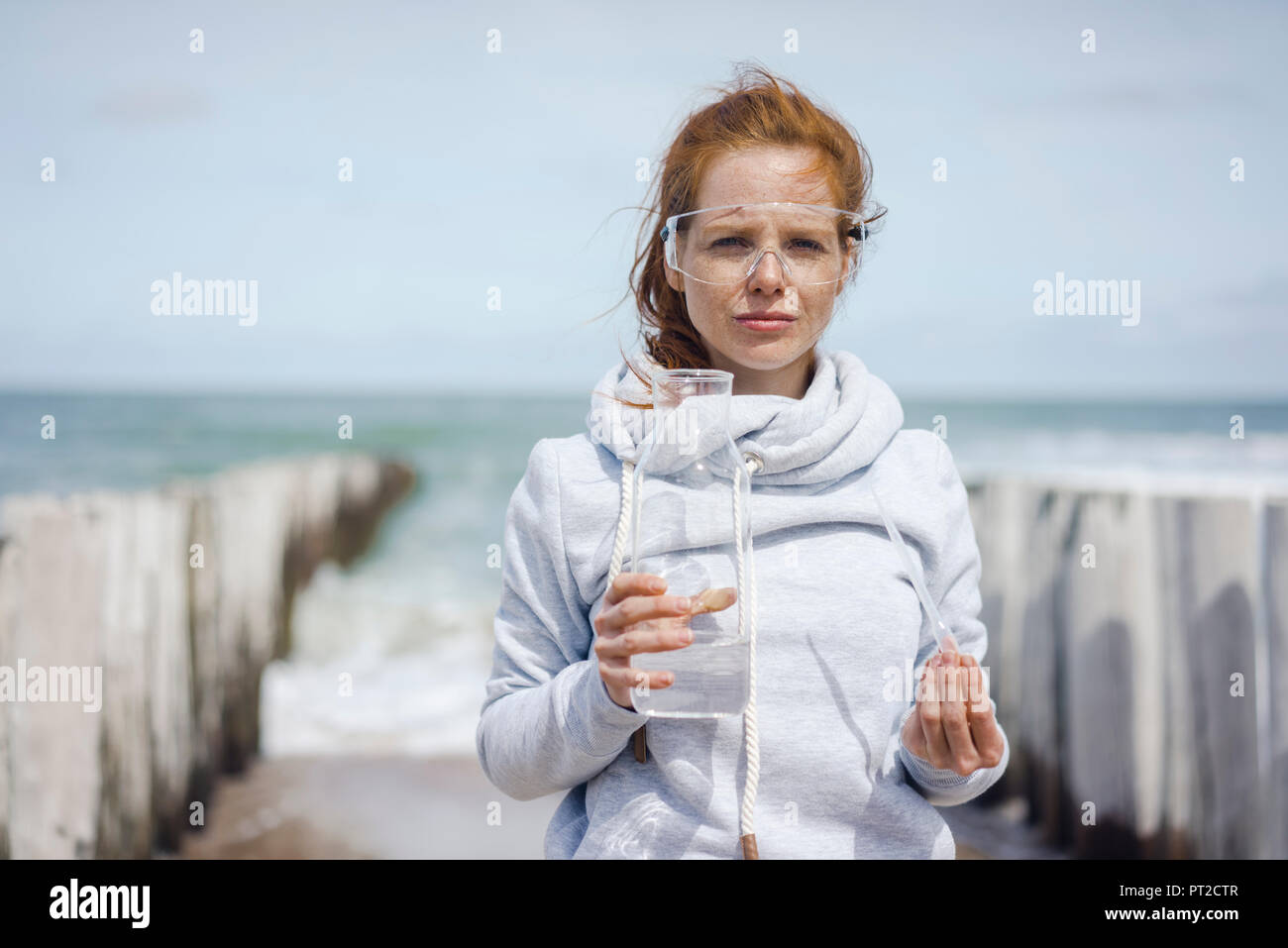 Scientist safety glasses taking water samples beach hi-res stock ...