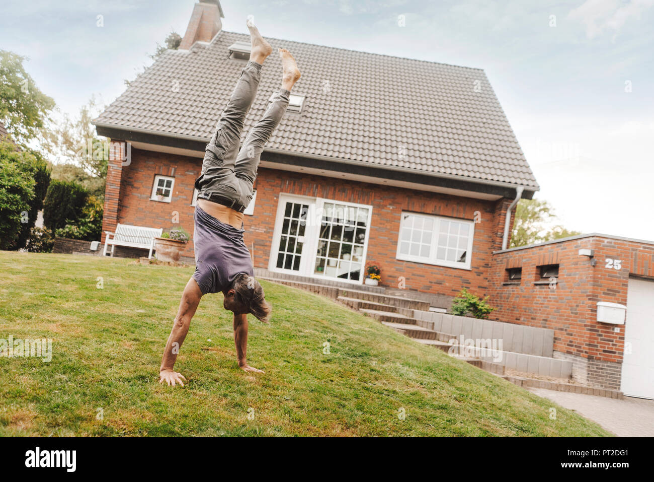 Man doing a handstand hi-res stock photography and images - Alamy