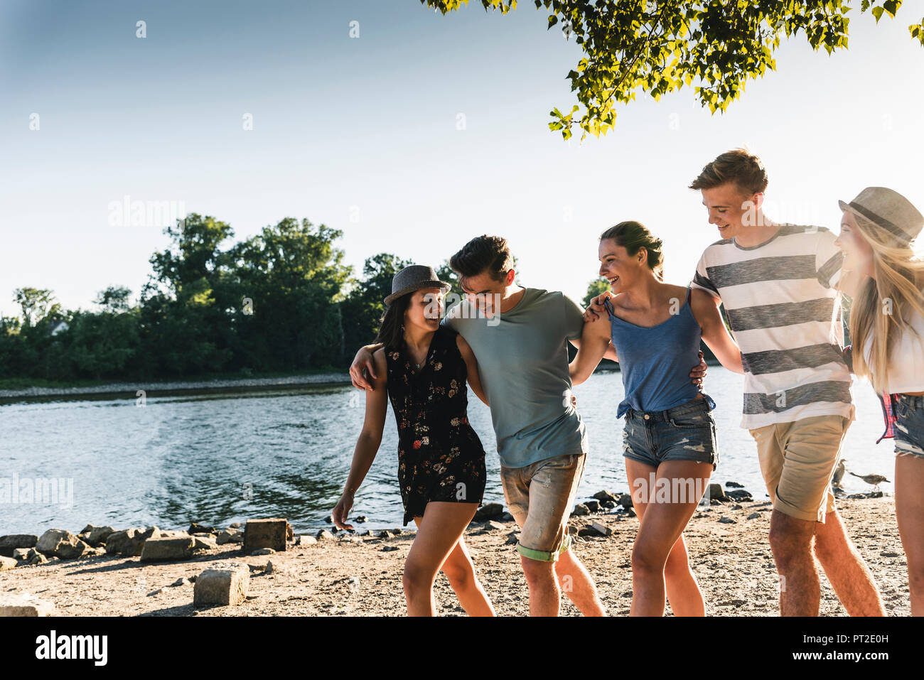 Group people summer arm in arm hi-res stock photography and images - Alamy