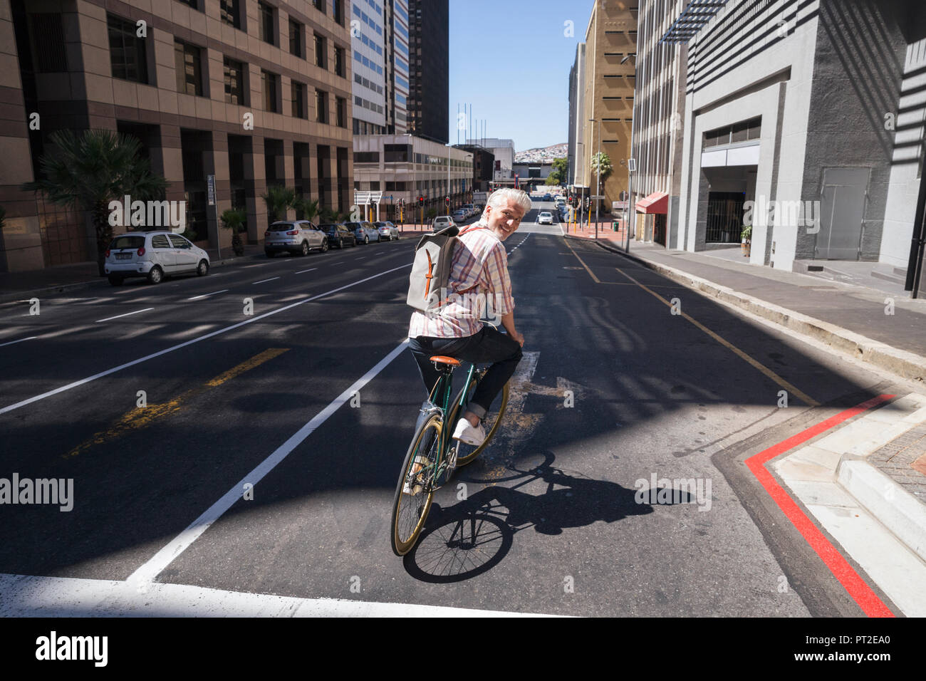 Rear view man bicycle hi-res stock photography and images - Alamy