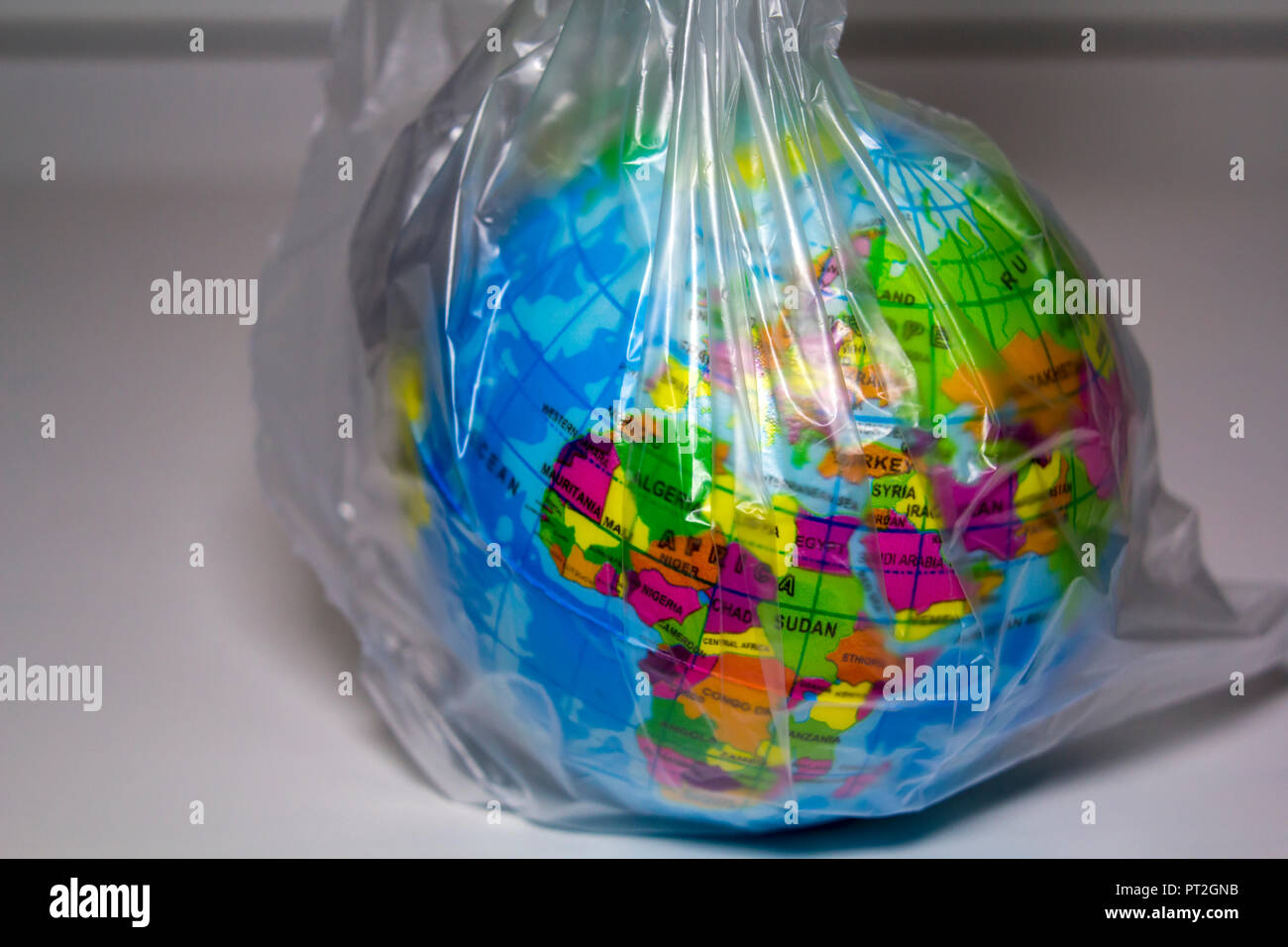 World wrapped in plastic. Plastic pollution concept Stock Photo - Alamy