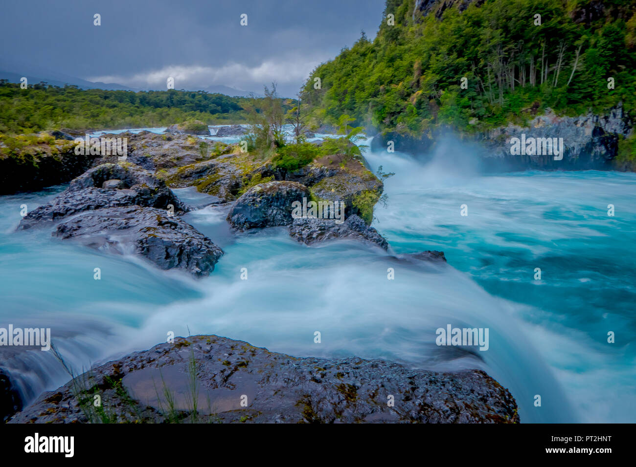 Gorgeous view of water passing through volcanic rock creating ...