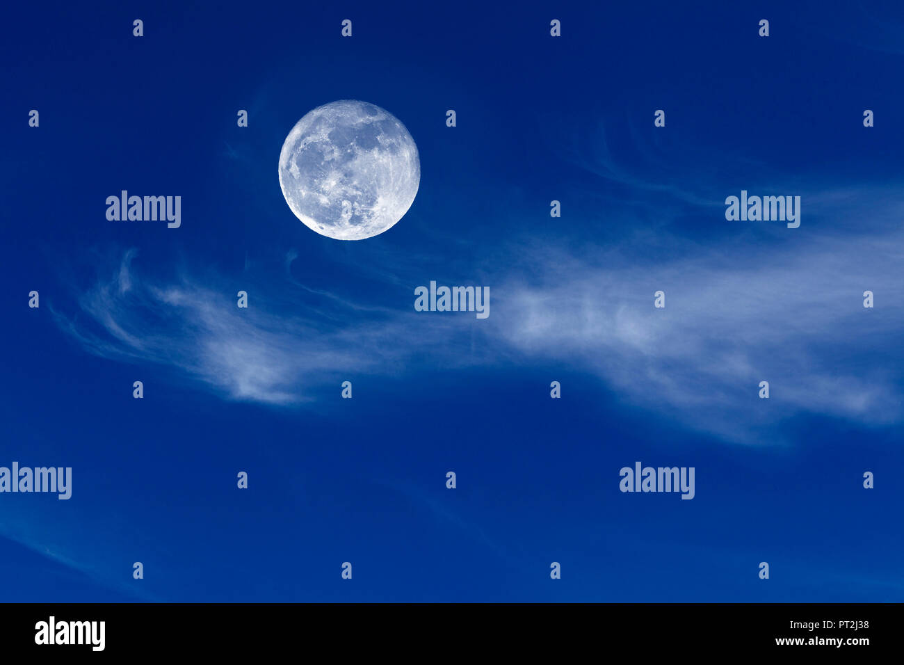 Feather clouds with full moon (M Stock Photo - Alamy