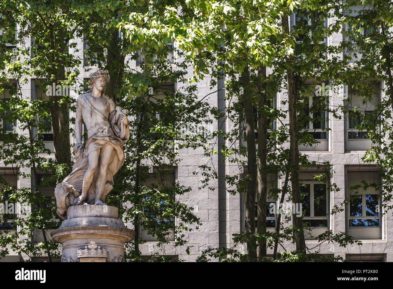 Fountain statue and trees in front of house facade hi-res stock ...