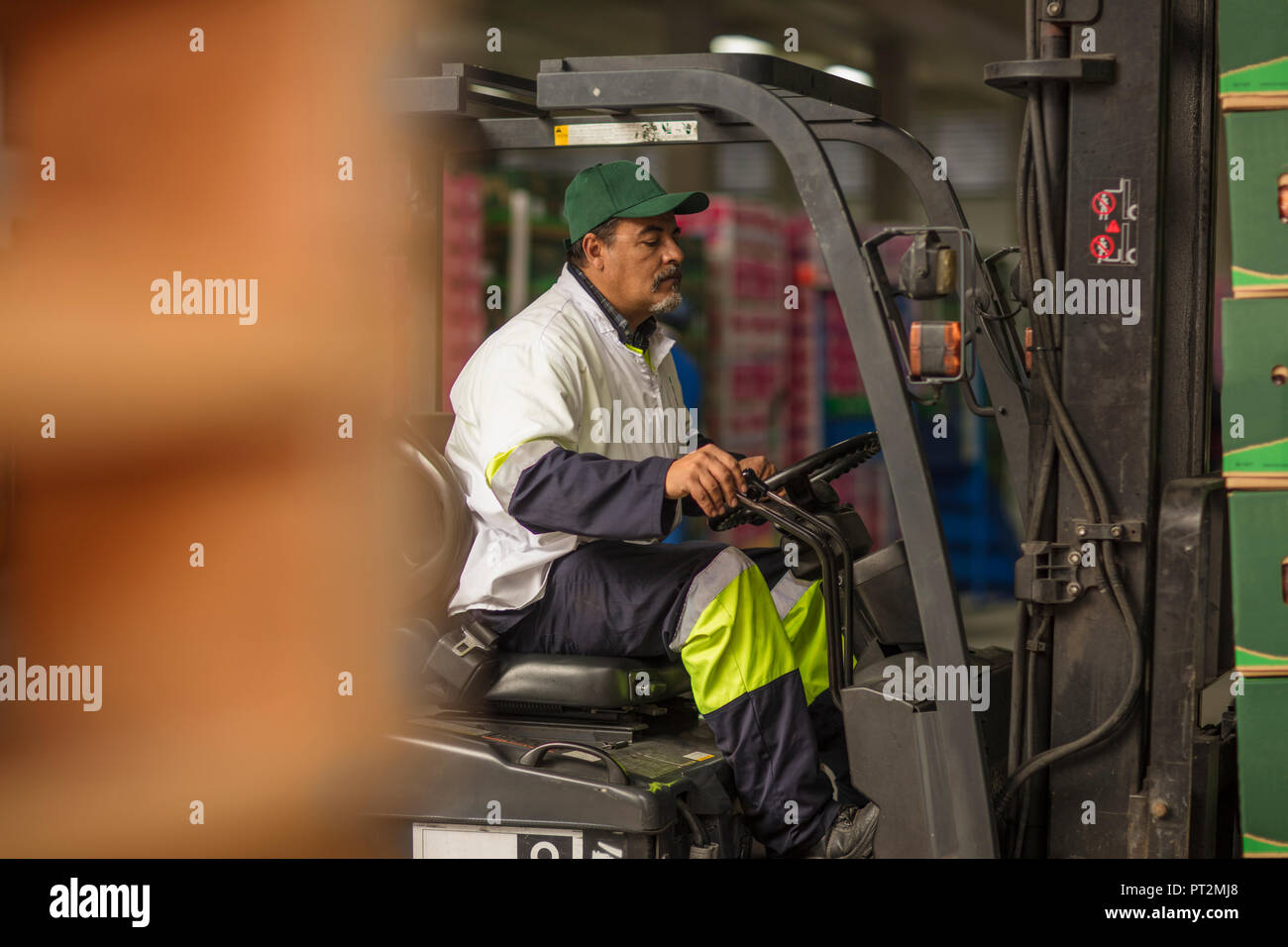 Worker in forklift Stock Photo - Alamy