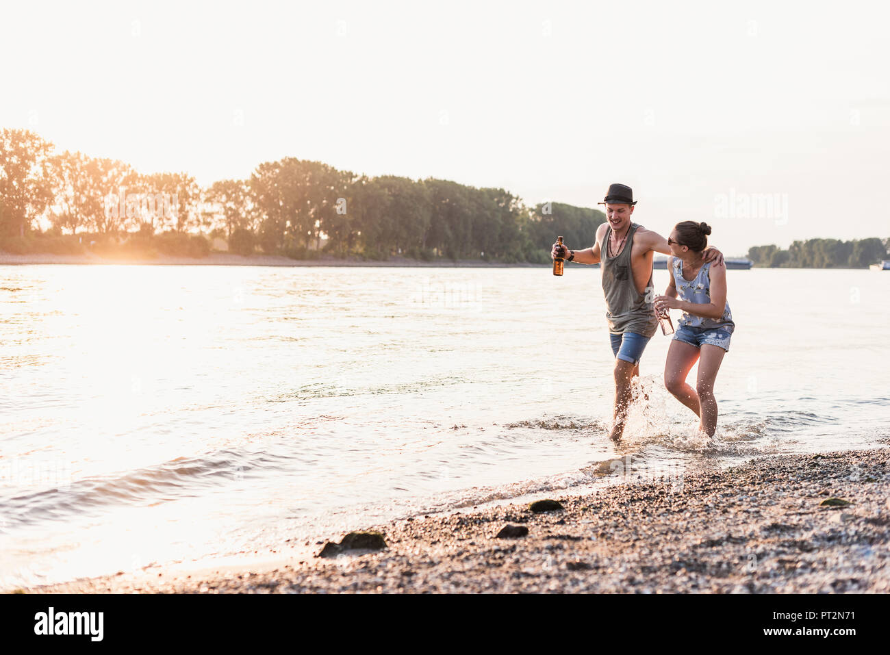 Couple wading hi-res stock photography and images - Alamy