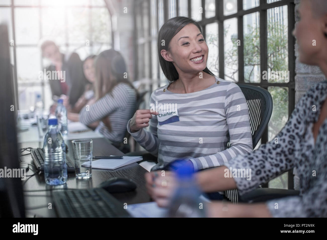 Woman introducing herself at educational centre hi-res stock ...