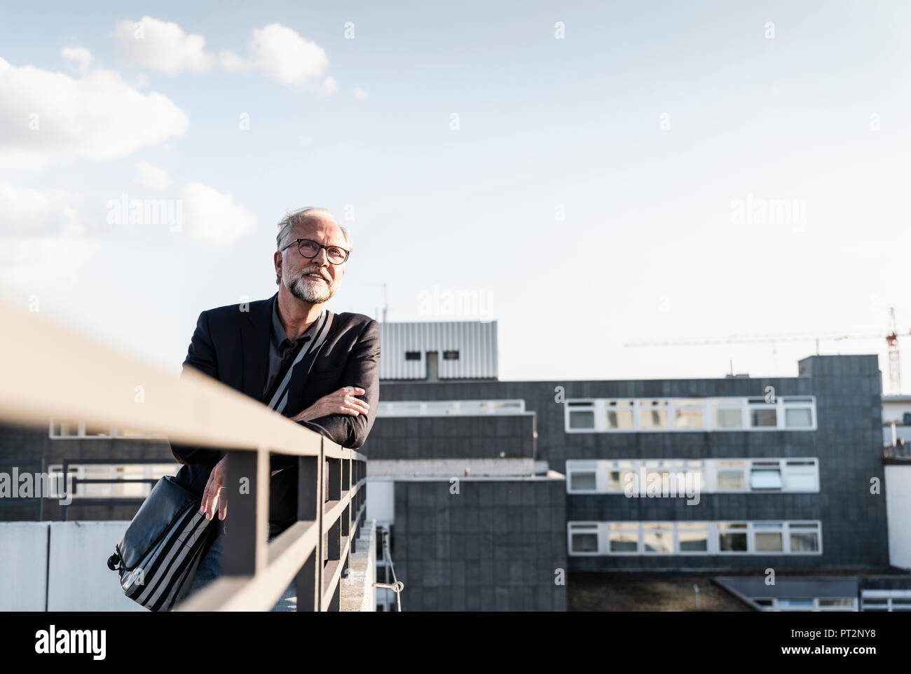 Mature man standing rooftop hi-res stock photography and images - Alamy