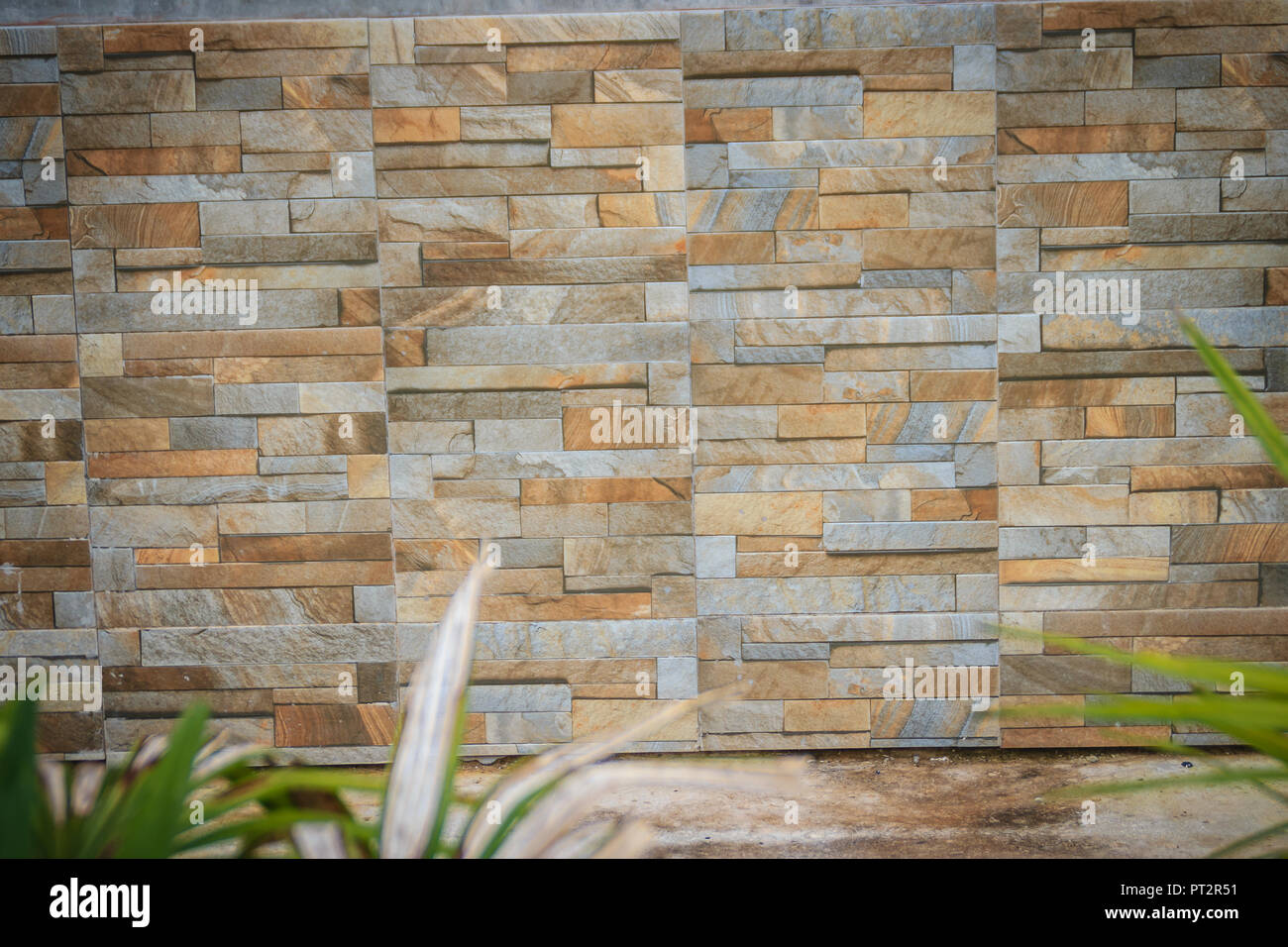 Wall tiles patterned like natural split stone background. Simulated ...