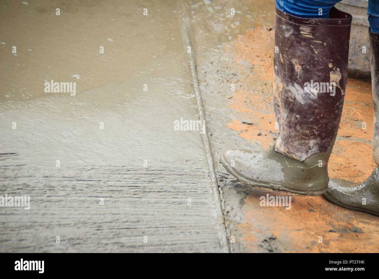 Grooving on concrete pavement by worker used deformed steel bar to ...
