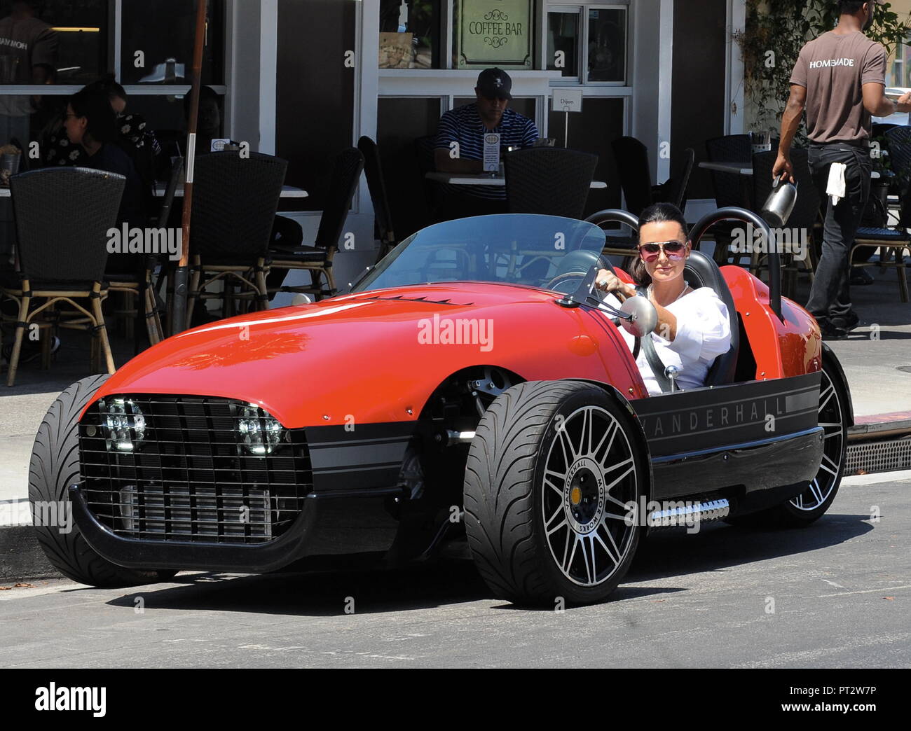 Kyle Richards arrives to meet Lisa Rinna in a three wheel Vanderhall ...