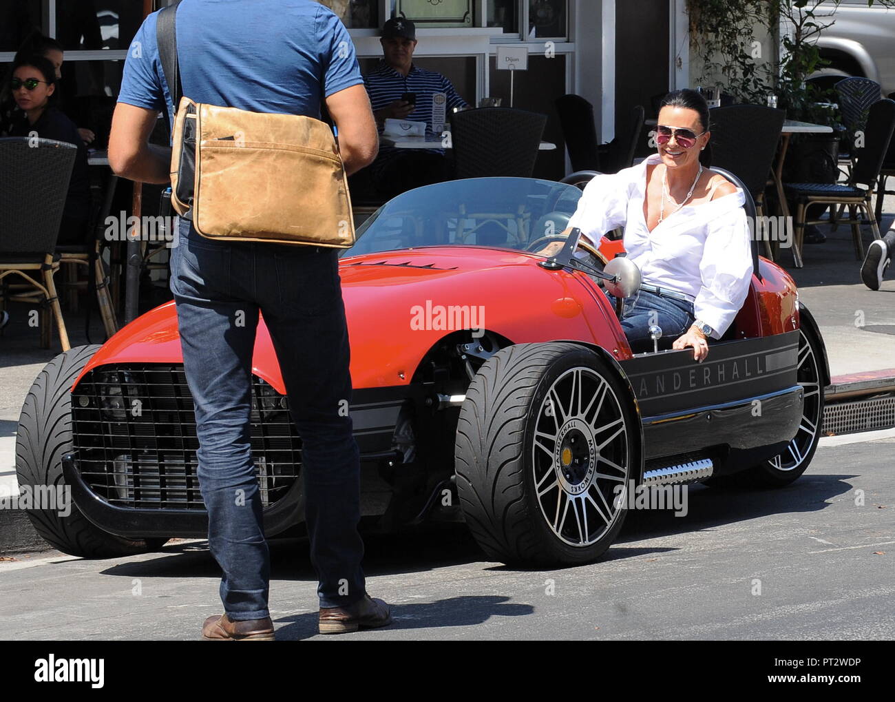 Kyle Richards arrives to meet Lisa Rinna in a three wheel Vanderhall ...