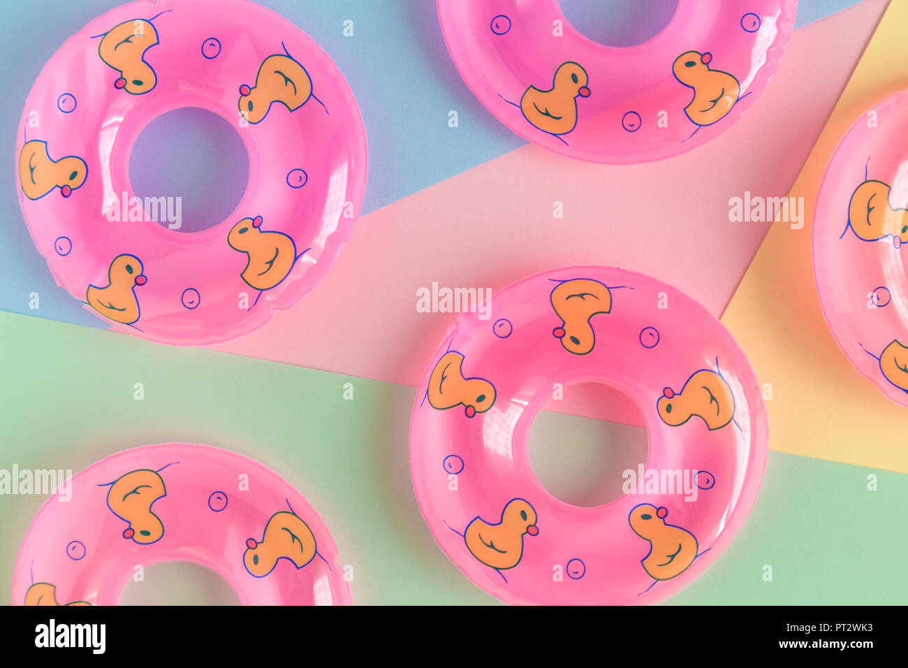 Inflatable pool float toys pattern on colorful pastel background ...