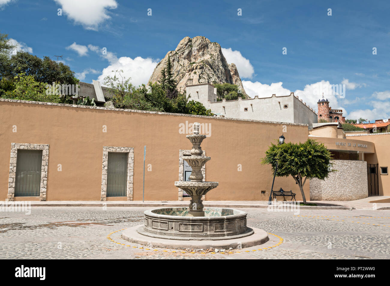 The massive monolith rock called the Pena de Bernal towers over a ...