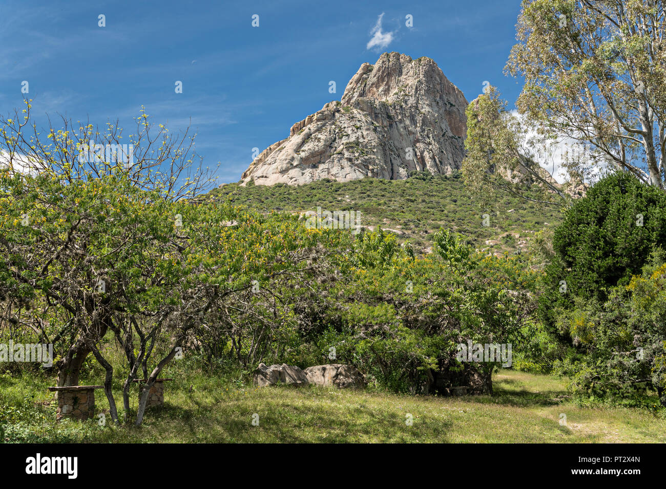 The massive monolith rock called the Pena de Bernal towers over the ...
