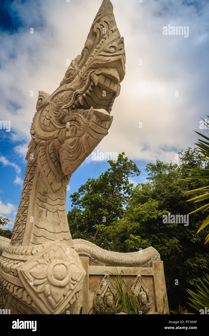 Beautiful naga head sculpture on the stairs leading up the temple on ...
