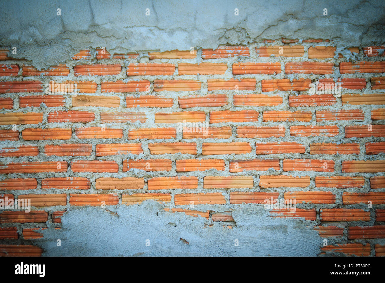 Unfinished brick wall plastering background with copy space. Under ...