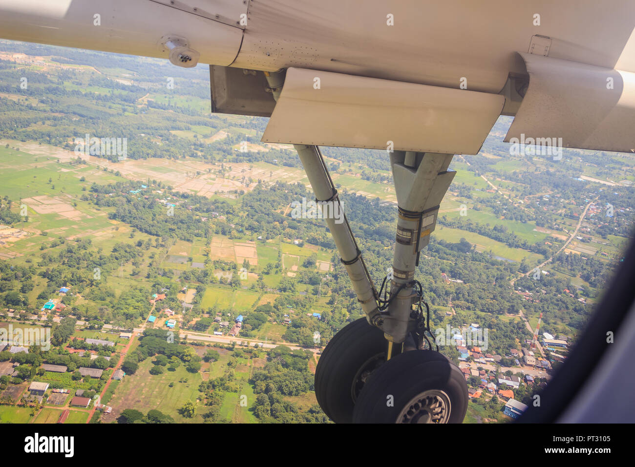 Aerial view of aircraft wheels in landing gear with motion blur ...