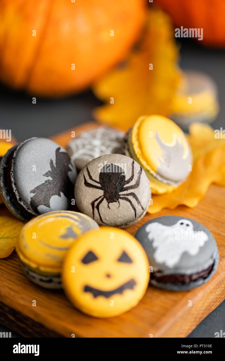 Halloween scary cookies with pumpkin on wooden cut board. pattern Bat ...