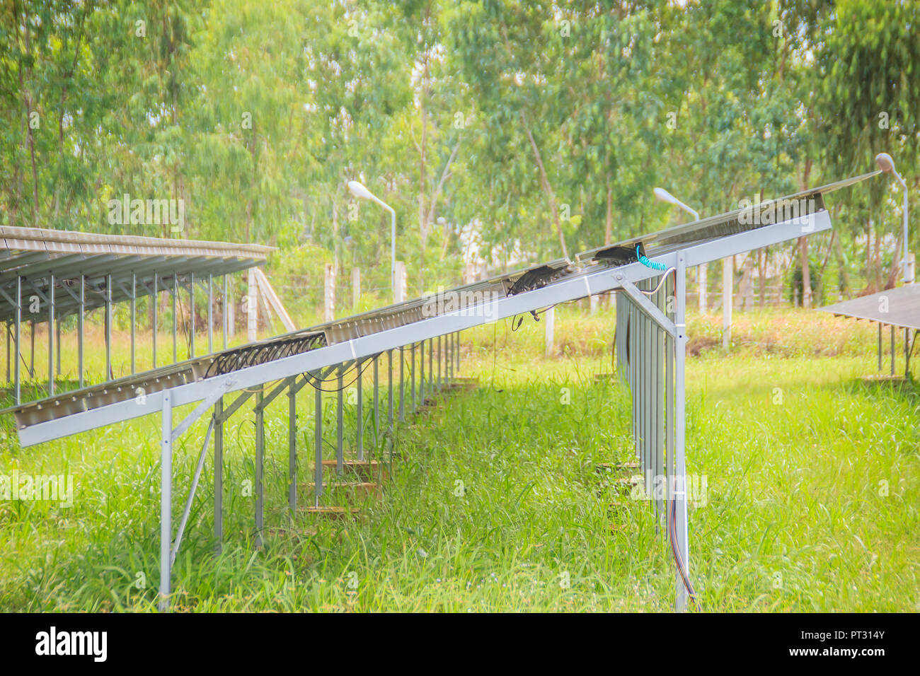 Large scale solar farm, mega photovoltaic power plant in green grass ...