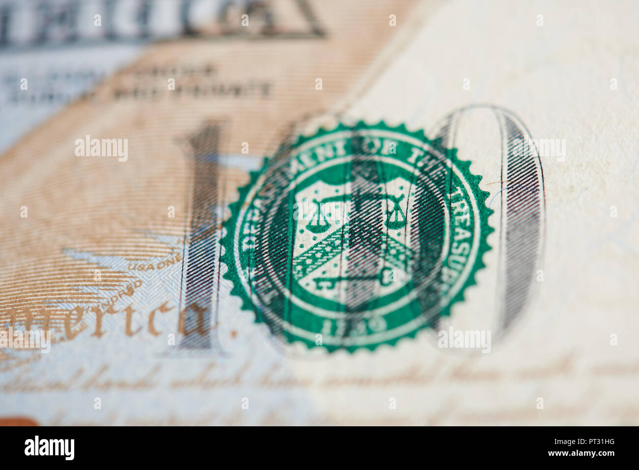 Stamp on hundred dollar bill close up view Stock Photo - Alamy