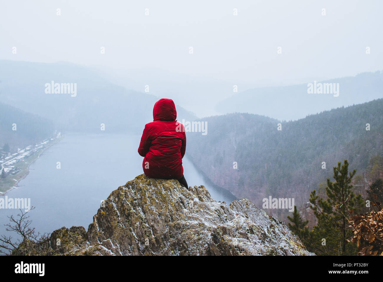 Person in red jacket hi-res stock photography and images - Alamy