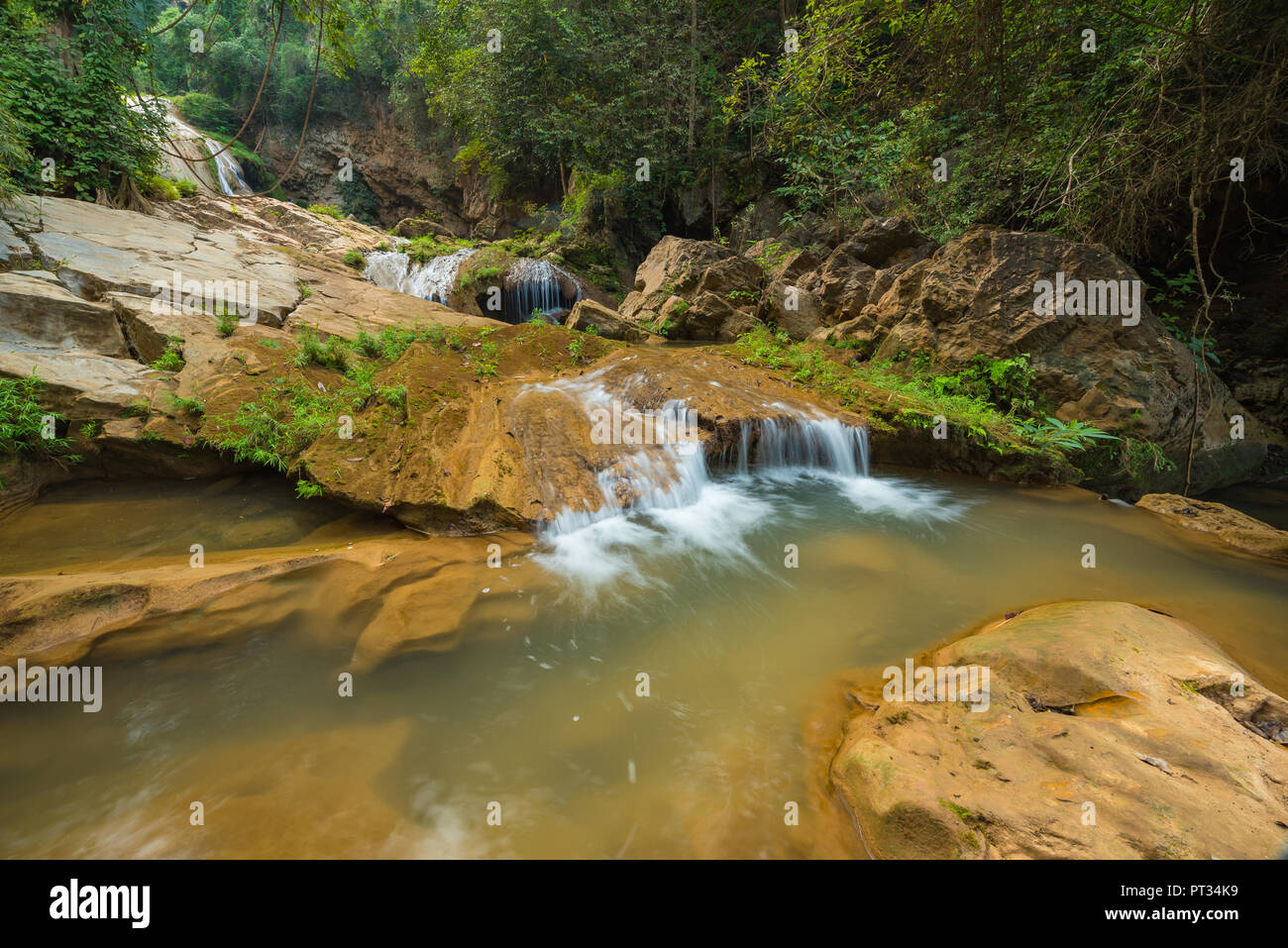 Gor Luang waterfall with beautiful emerald color water of Lamphun ...