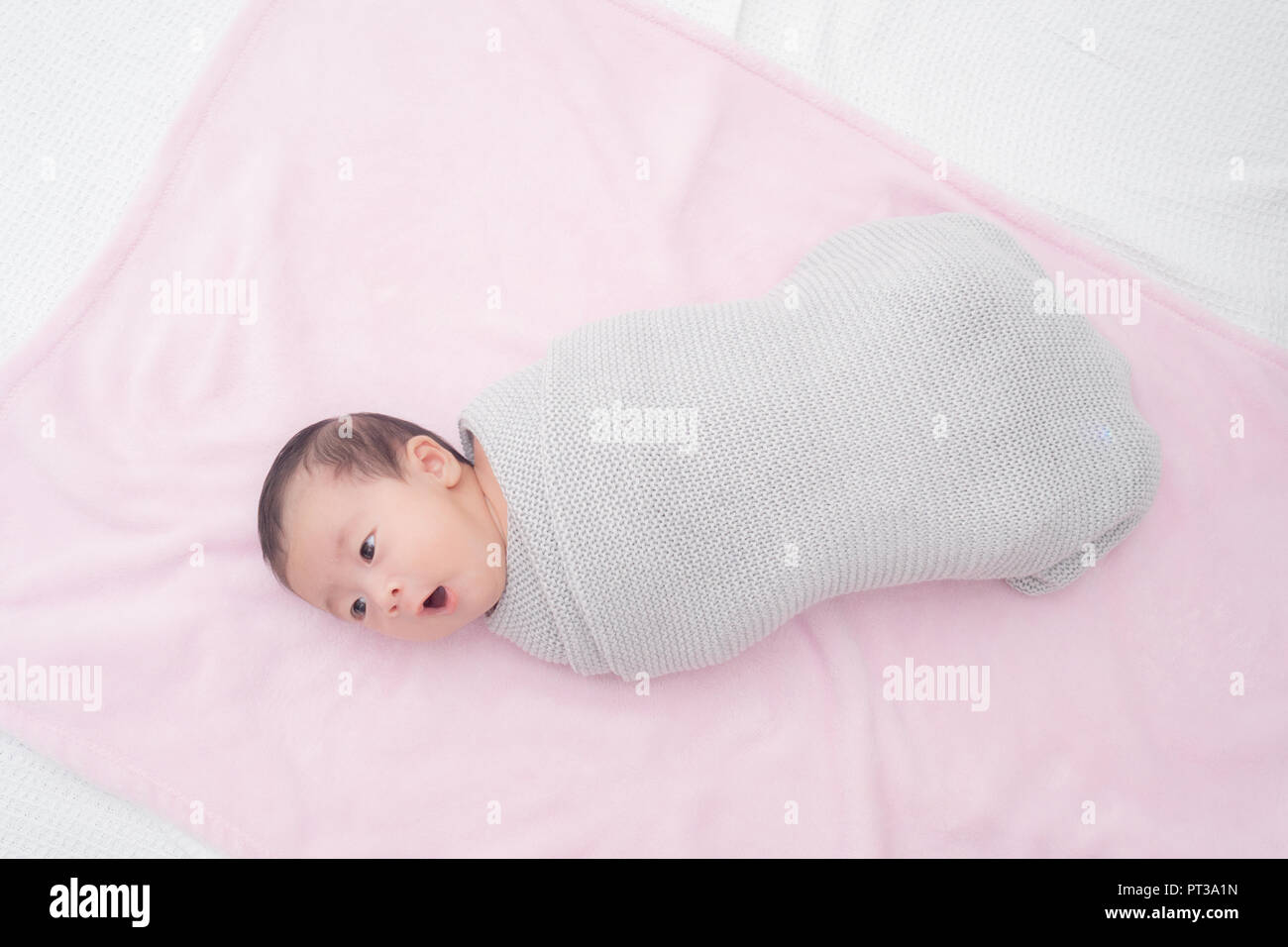 Newborn wrapped hi-res stock photography and images - Alamy