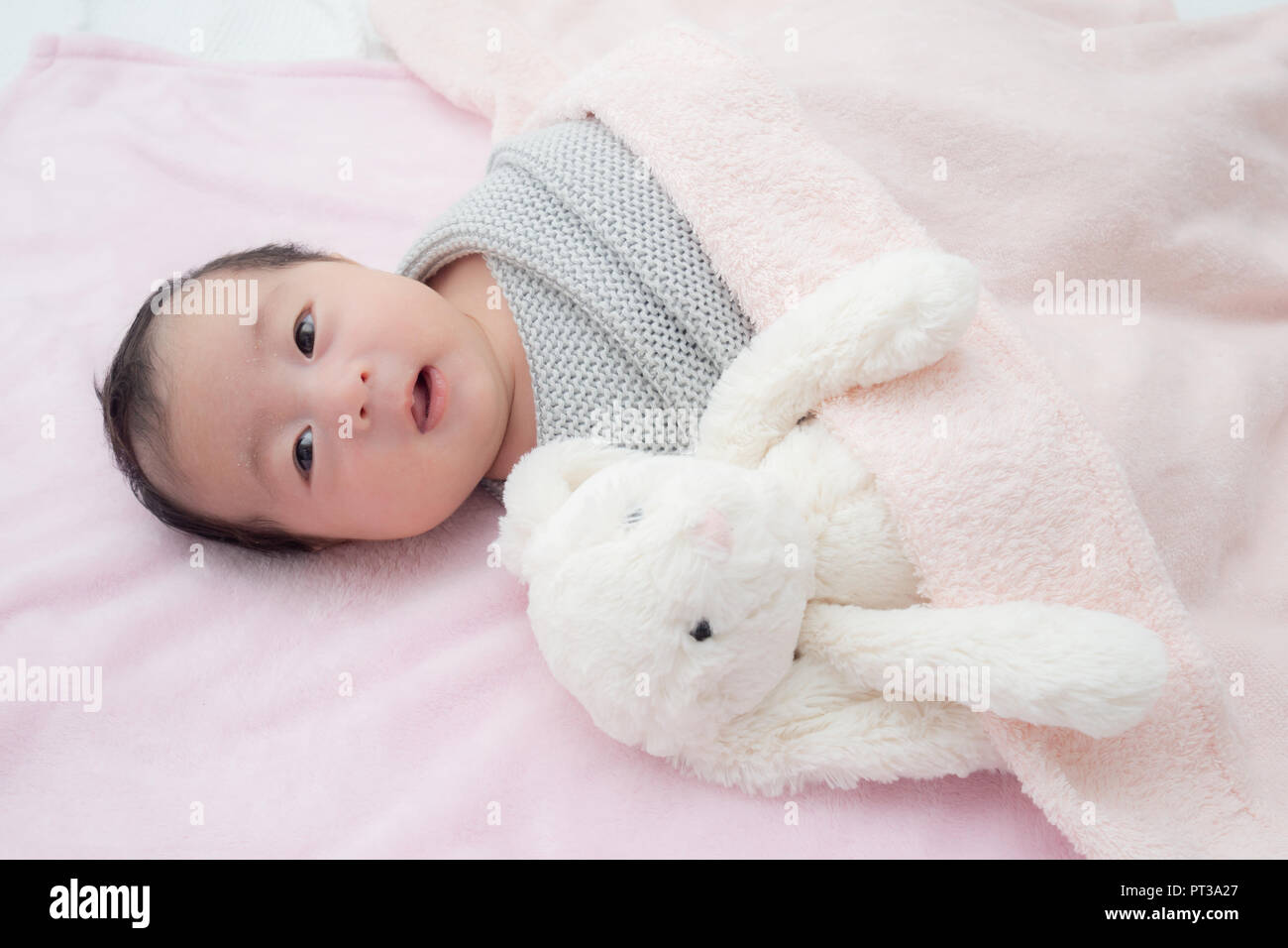 New born baby wrapped in blanket hi-res stock photography and images ...