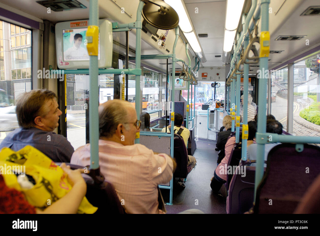 TOURISTS INSIDE A PUBLIC TRANSPORT BUS IN KOWLOON, HONG KONG Stock ...