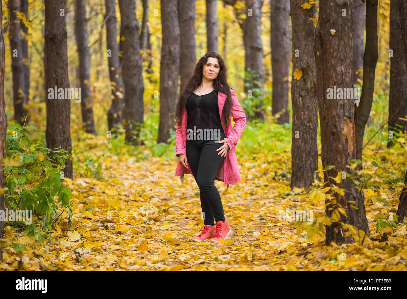 Weather, season, people concept - plus size woman in pink coat over the ...