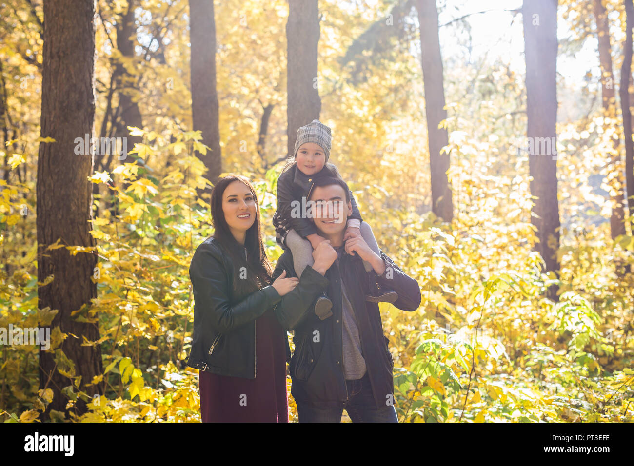 Children, nature and family concept - Portrait of happy family over ...