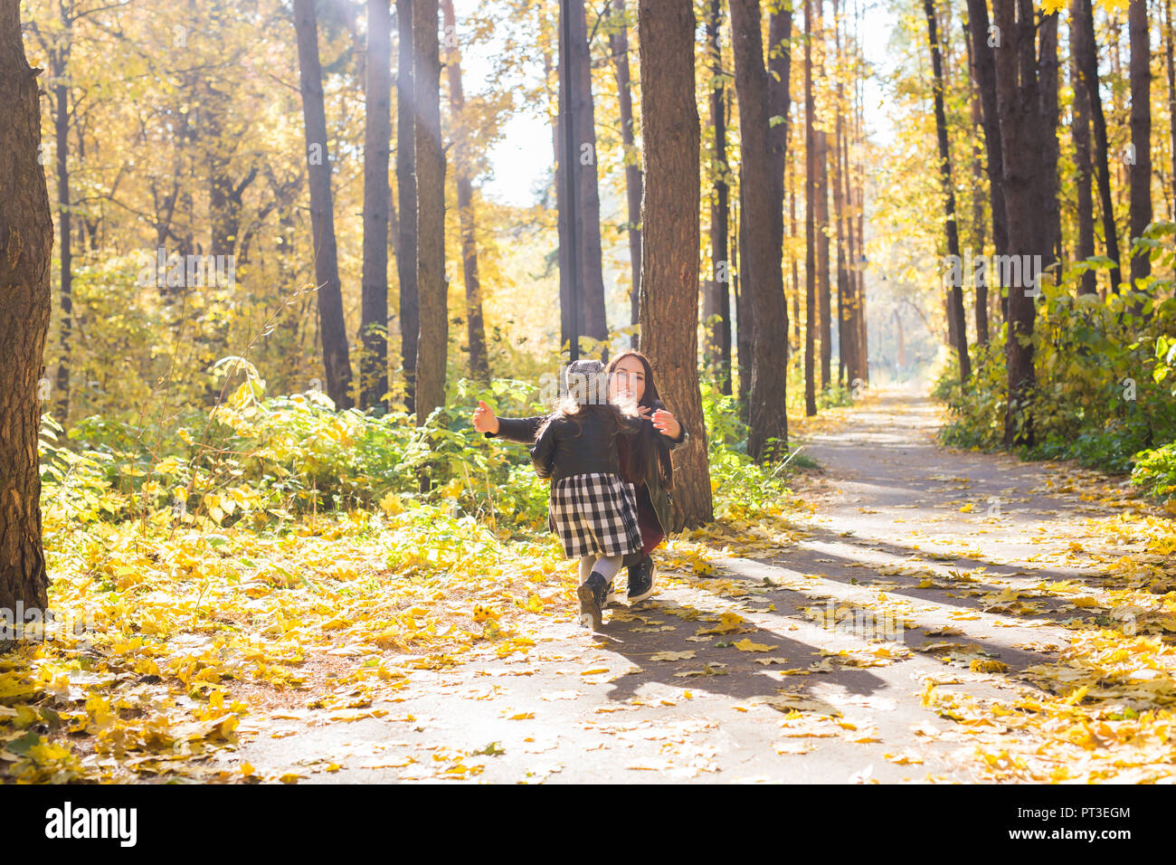 Fall, family, people concept - mother and daughter having fun in the ...