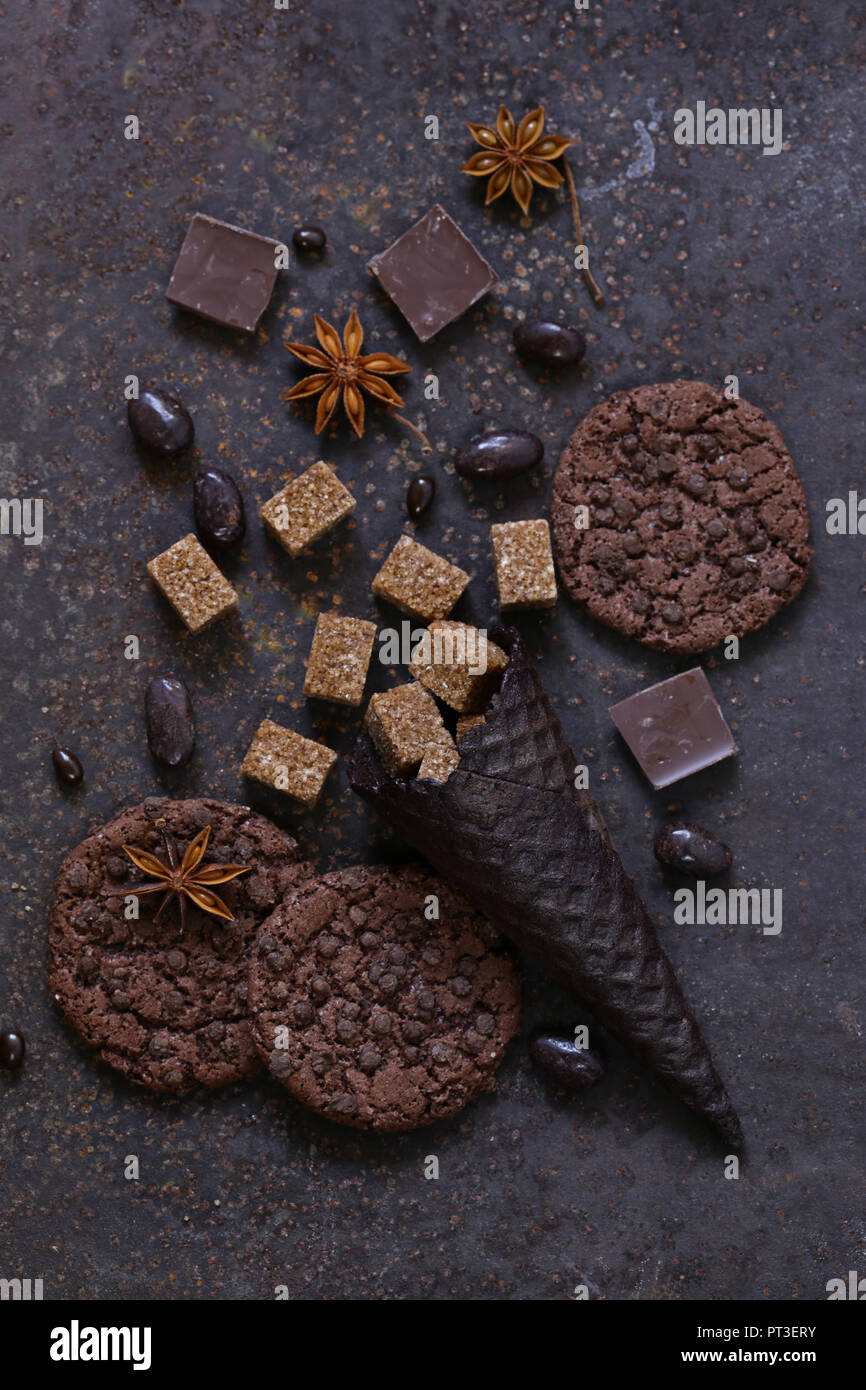 chocolate chip cookies and candy on a brown background Stock Photo - Alamy