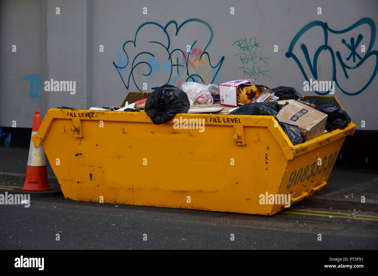 Rubbish fire skip hi-res stock photography and images - Alamy