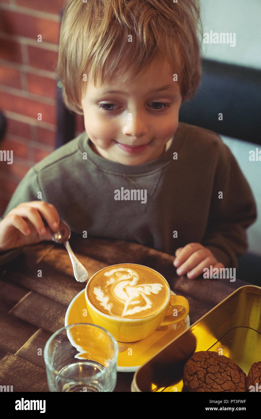 Little boy drinking from a cup hi-res stock photography and images - Alamy