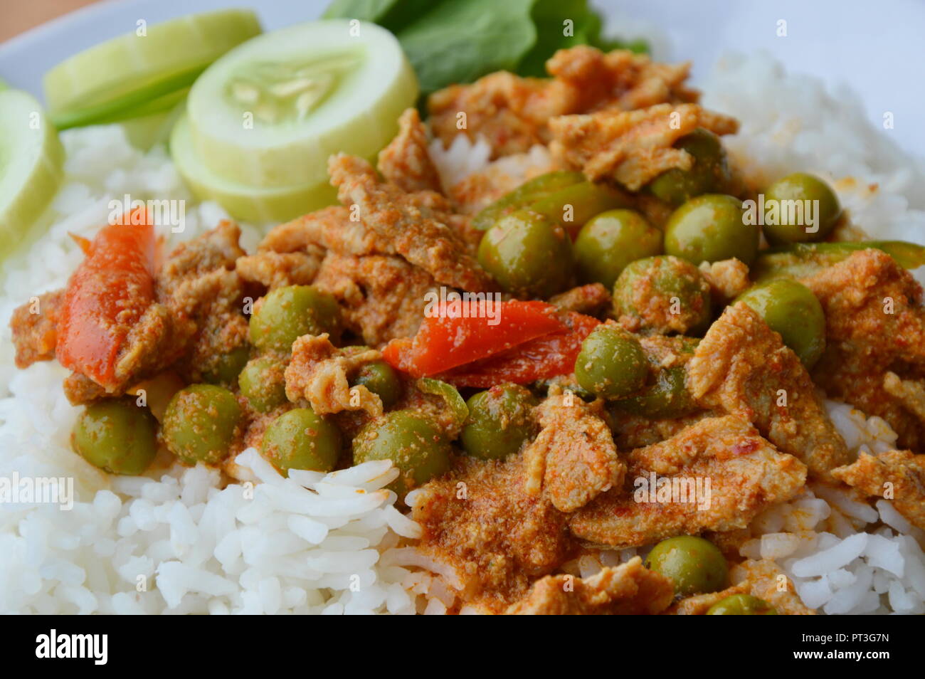 savory curry with pork on plain rice Stock Photo - Alamy