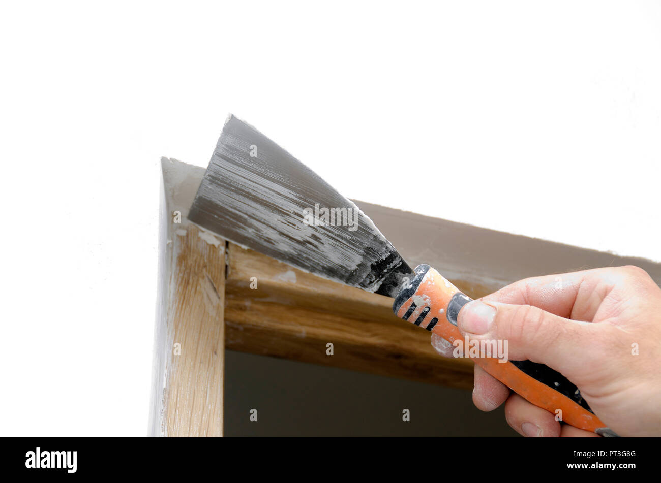 mason applying plaster with a spatula Stock Photo - Alamy