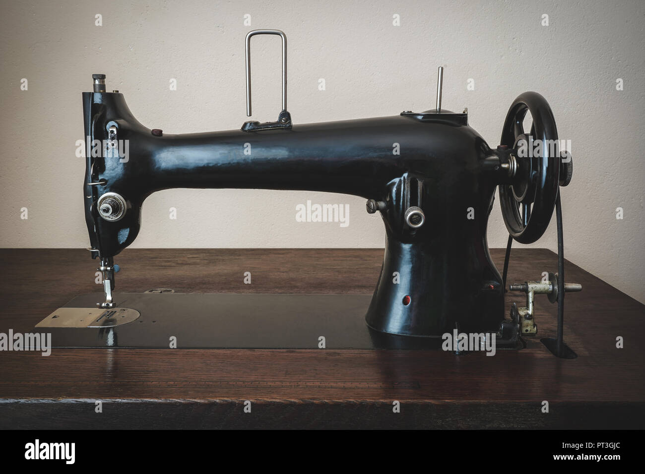 An old rustic machine used to sew various fabrics and clothes Stock ...