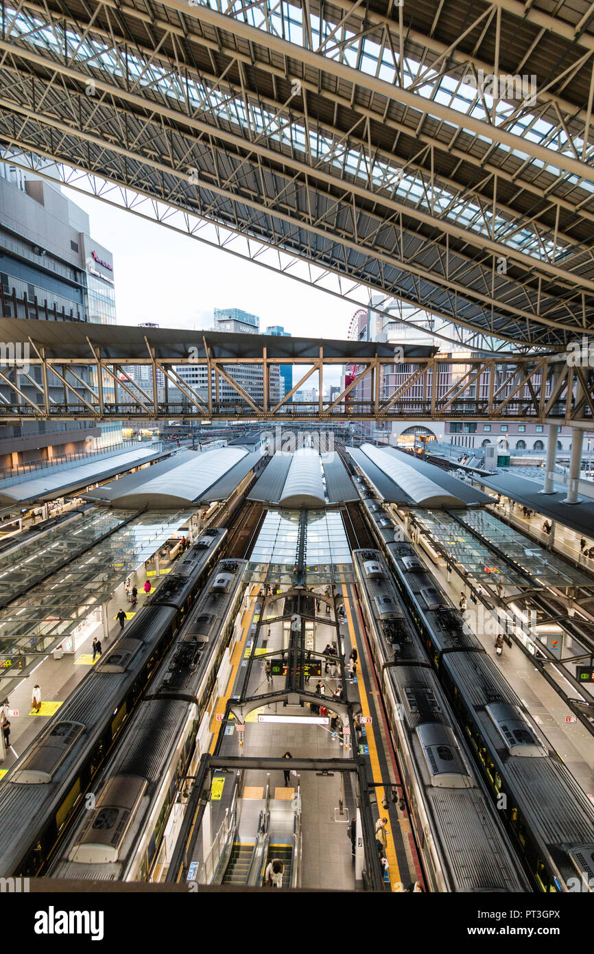 Osaka Station City. High angle view over the platforms and tracks with ...