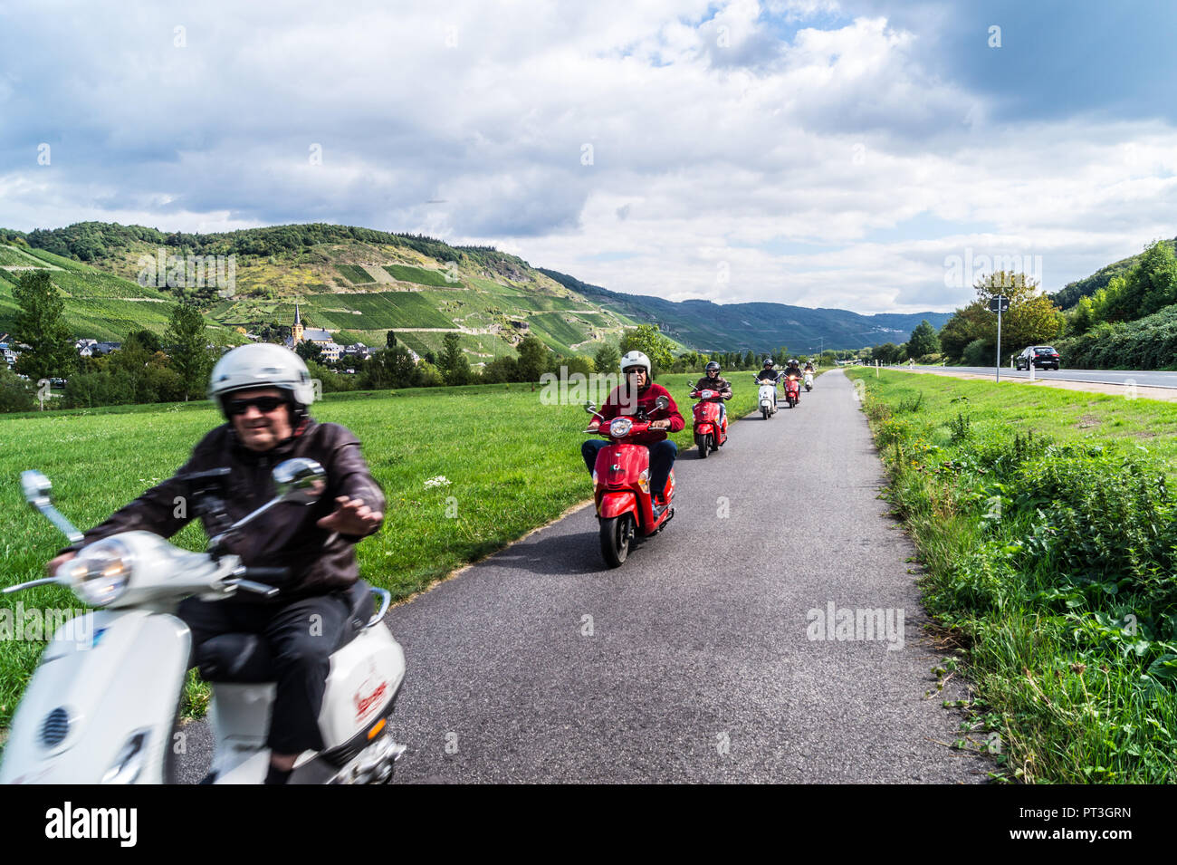 Motor scooter riders hi-res stock photography and images - Alamy