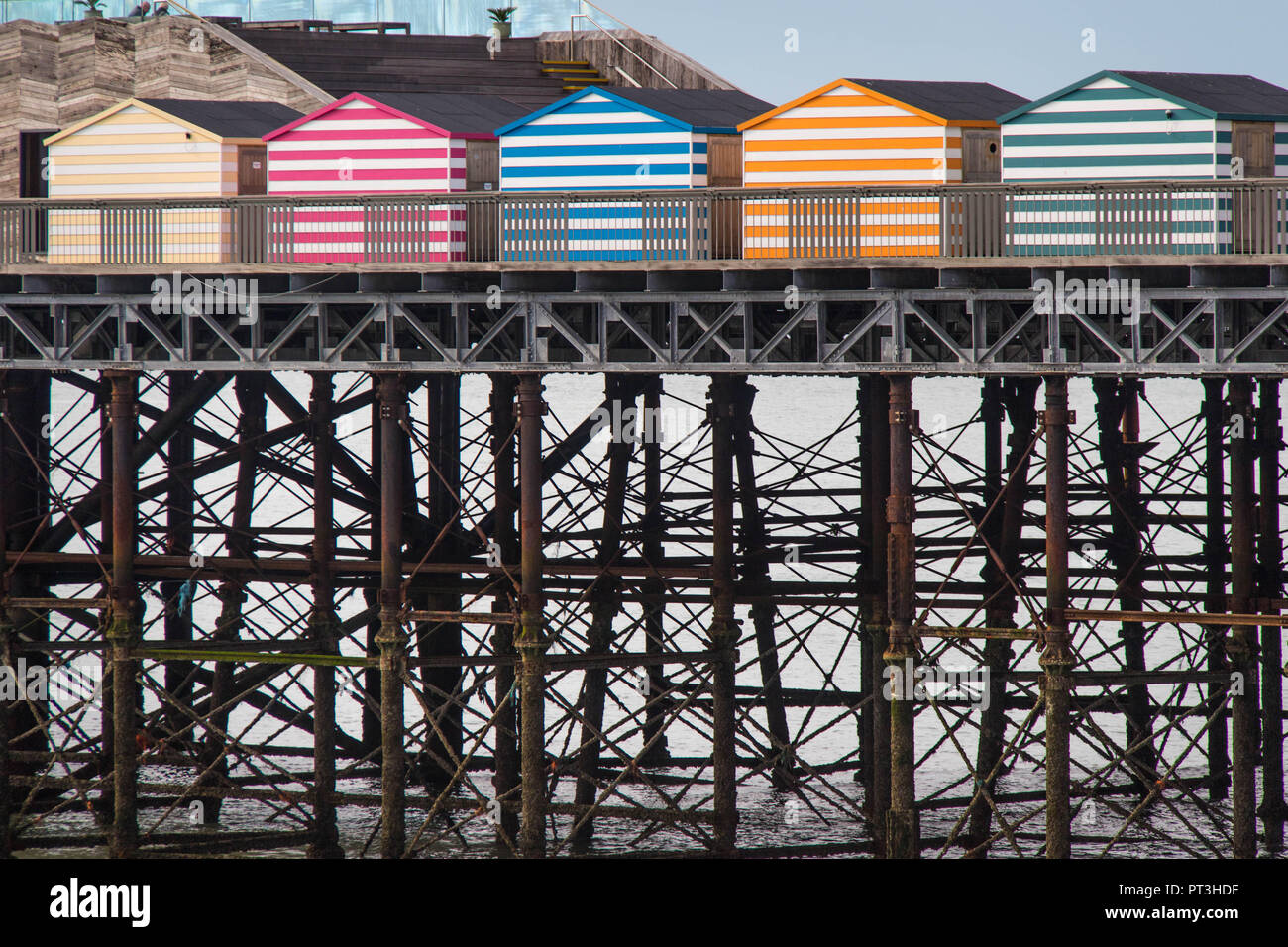 Beach huts on Hastings pier Stock Photo - Alamy