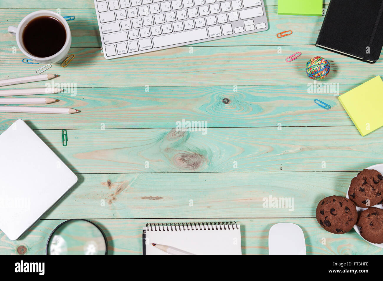 Blue office desk table with with office supplies. Top view with copy ...
