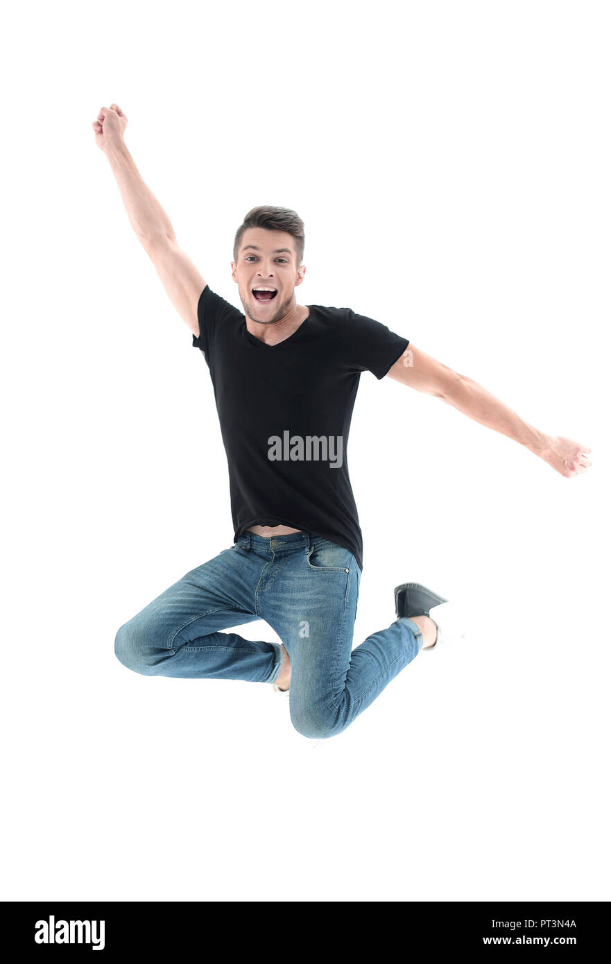 Happy excited cheerful young man jumping and celebrating success Stock ...