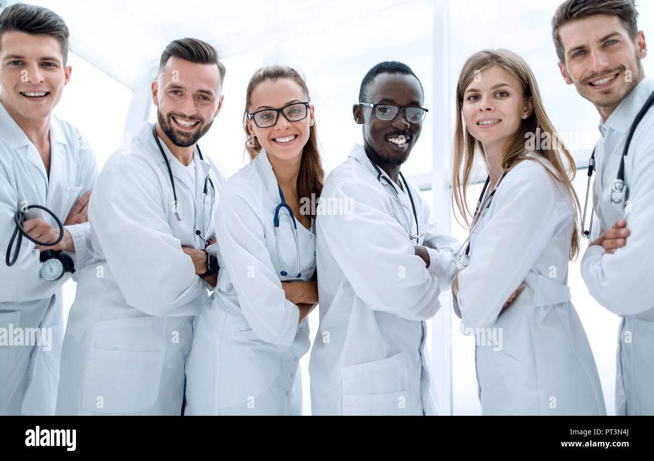 smiling medical team standing together isolated on white Stock Photo ...