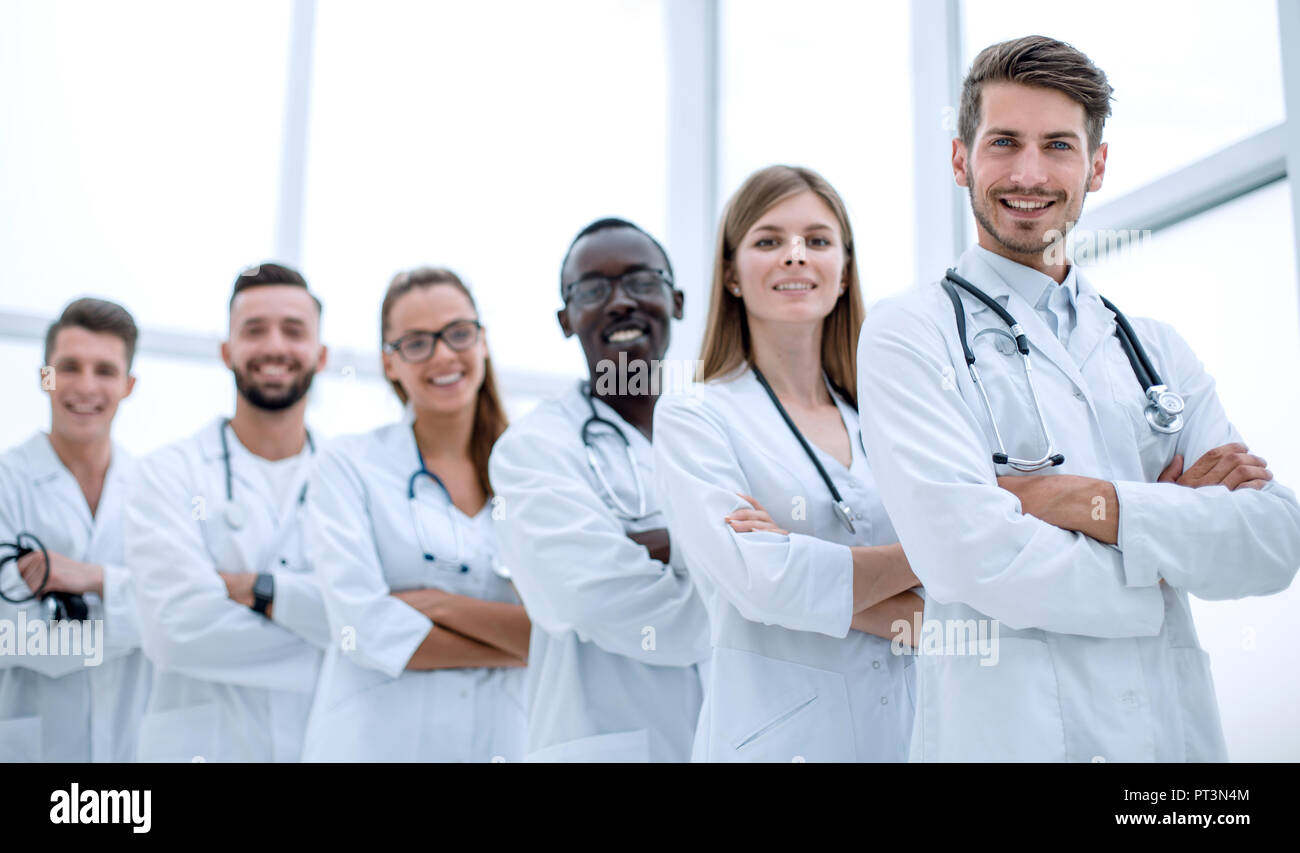 Portrait of group of smiling hospital colleagues standing together ...