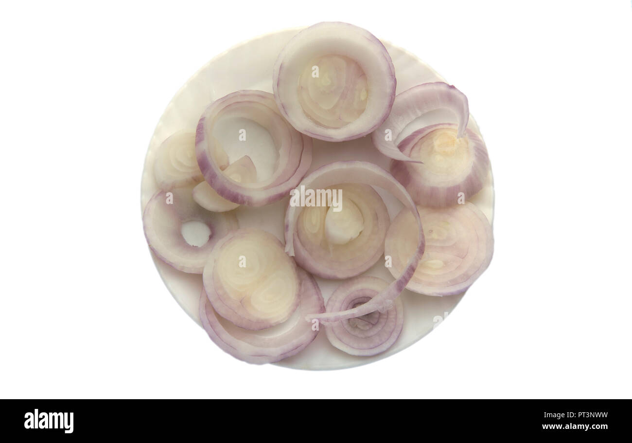 Sliced red onion on a plate isolated on white background mumbai india ...